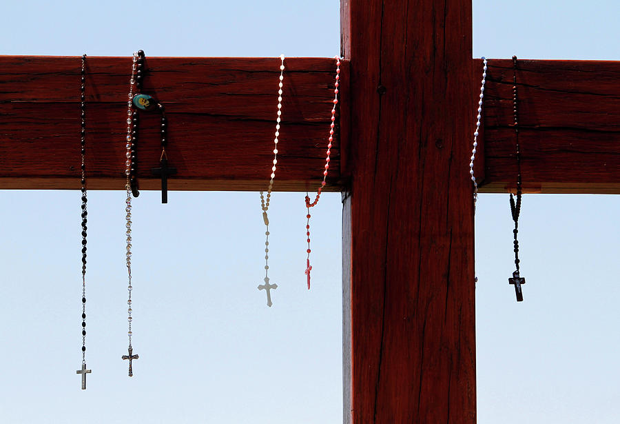 Crosses Hang on a Cross Near the Site Photograph by Dado Ruvic - Fine ...