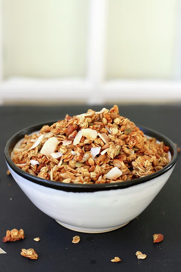 Crunchy Muesli In A Ceramic Bowl Photograph by Ursula Schersch