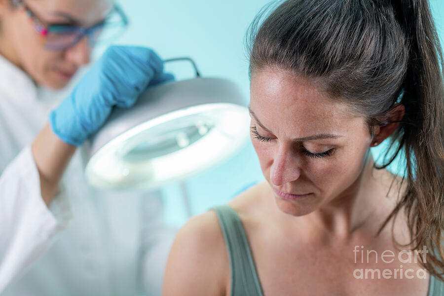 Dermatologist Checking Mole by Microgen Images/science Photo Library