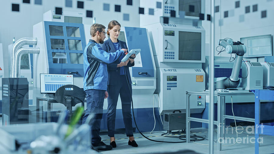 Engineer And Machinery Operator Using A Tablet Computer Photograph by ...