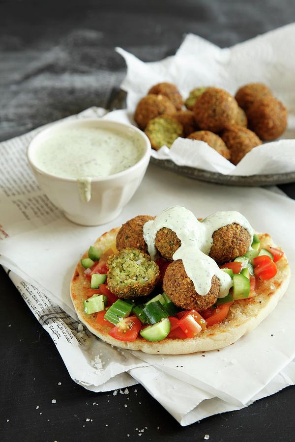 Falafel On Pita Bread With A Vegetable Salad And Tahini Photograph by ...