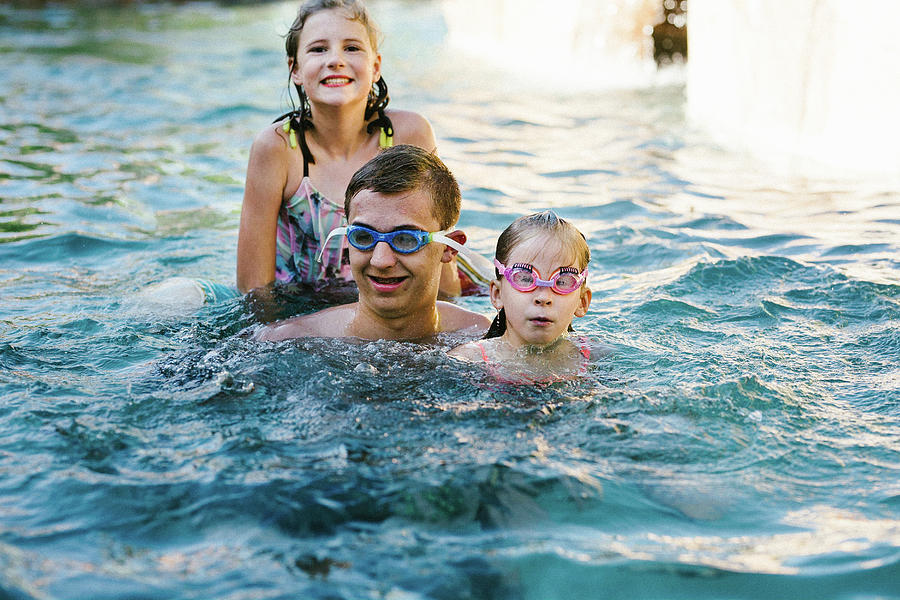 Kids Play And Splash In Swimming Pool With Goggles On In Summer ...
