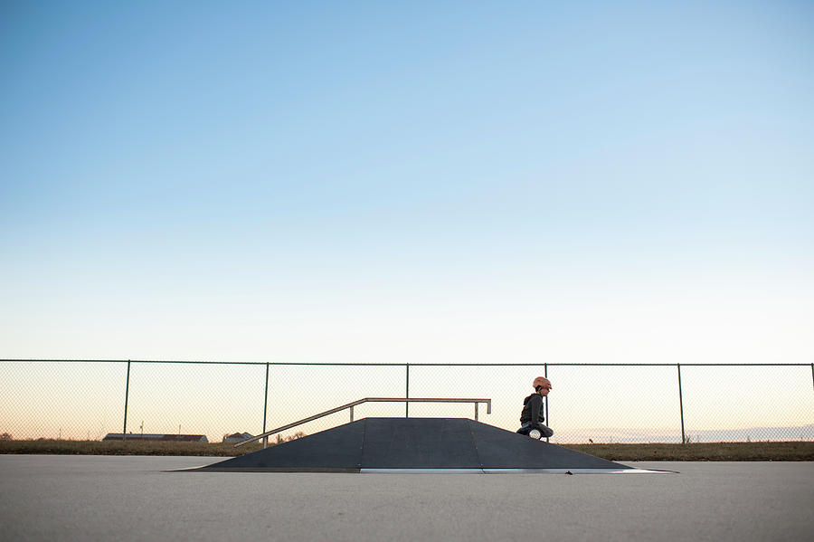 Little Boy Coming Down Ramp At Skate Park On His Hover Board Photograph ...