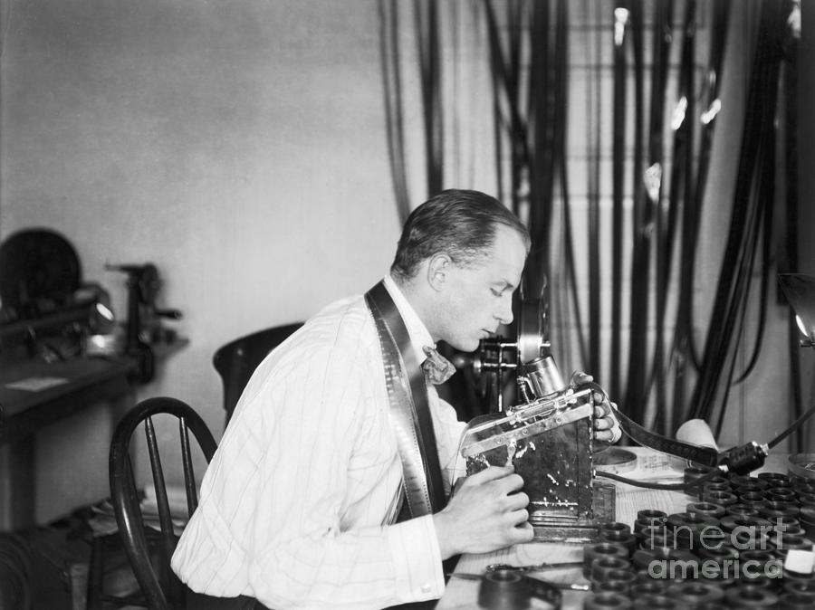 Man Editing Film Editing Machine by Bettmann