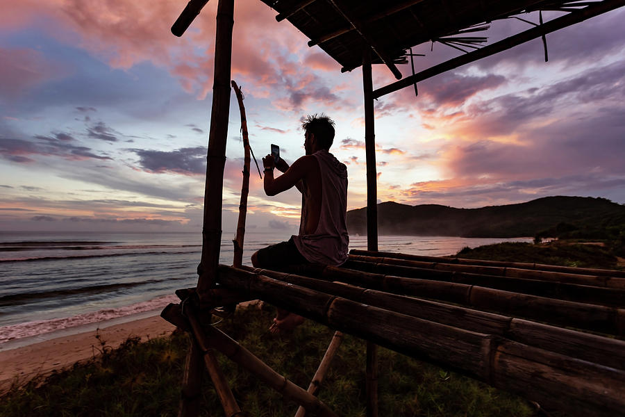 Man Photographing From Tower On Beach Photograph by Konstantin Trubavin - Fine Art America