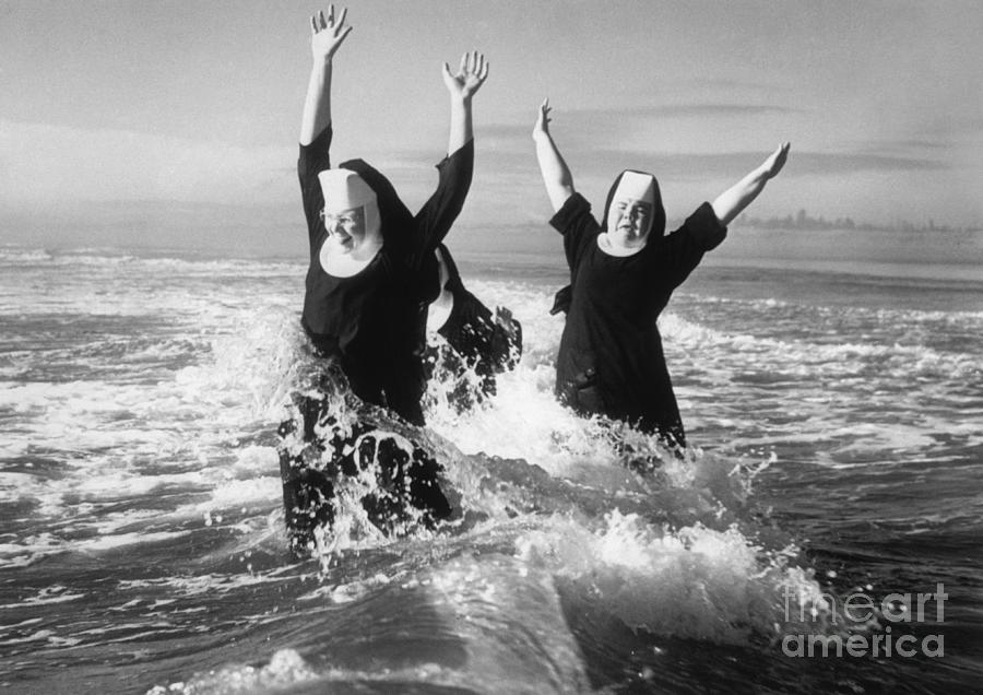 Nuns Playing In Water by Bettmann