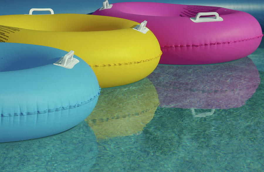 Pool floating rings with reflections Photograph by Mark Evers - Fine ...