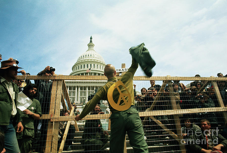 Protester Throwing Combat Jacket by Bettmann
