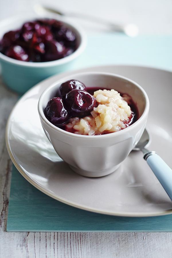 Rice Pudding With Cherries And Cherry Syrup Photograph by Charlotte ...