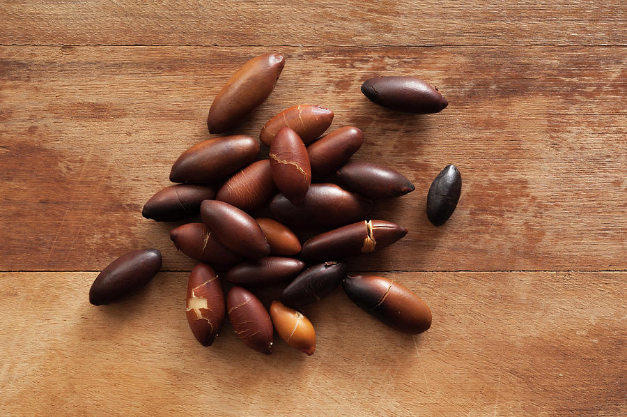 Roasted Baru Seeds Also Known As Baru Almonds On Wood Cutting Board