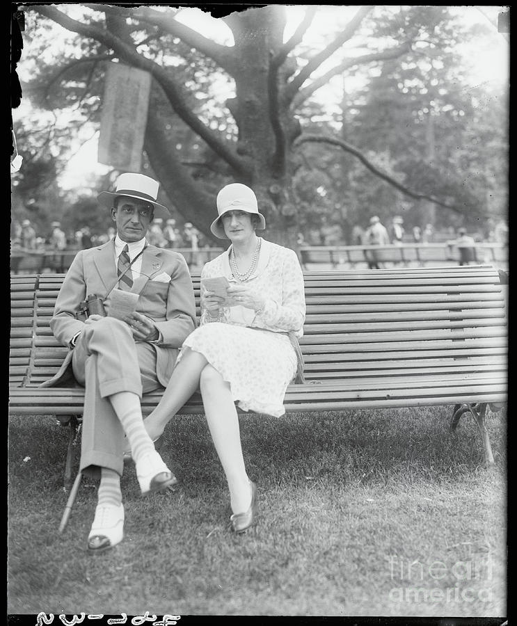 Socialites Sitting On Bench by Bettmann