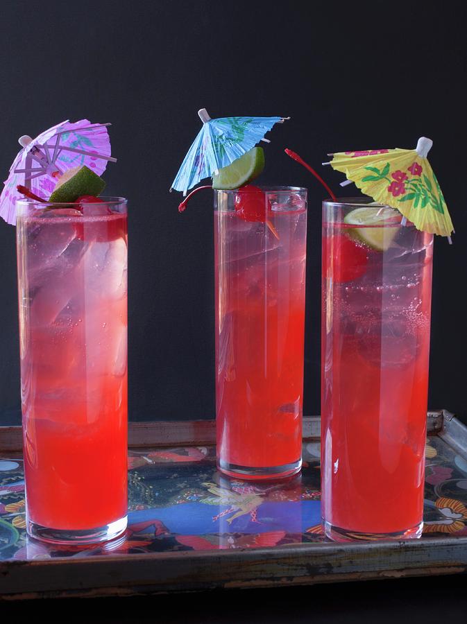 Three Singapore Slings With Cocktail Umbrellas On A Tray Photograph By Katharine Pollak Fine