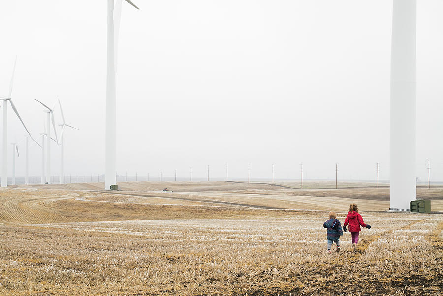 Two Children Walk Toward A Line Of Giant Windmills Photograph by Cavan ...