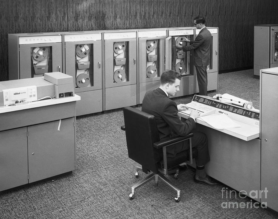 Two Men Working With Early Mainframe by Bettmann