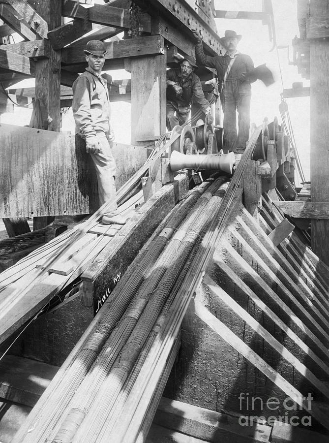 Workers On Brooklyn Bridge Construction by Bettmann