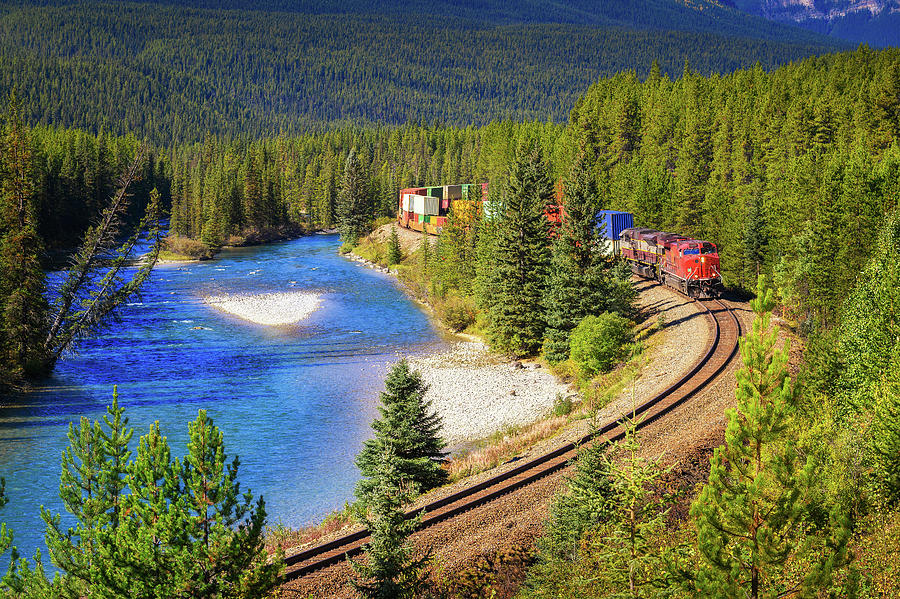 Train passing through Morant's Curve in bow valley, Canada Photograph by Miroslav Liska - Fine ...