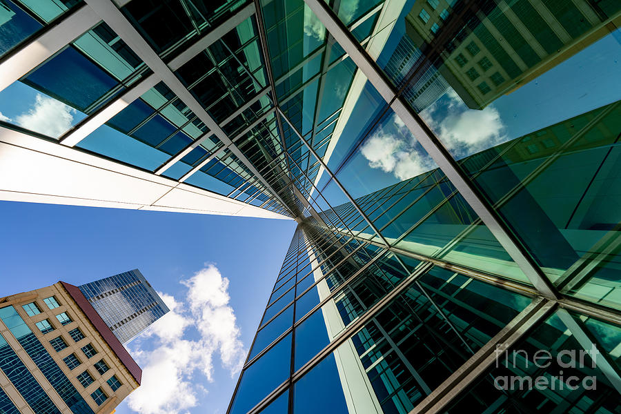Ground angle photo looking directly up towards highrise towers in the ...