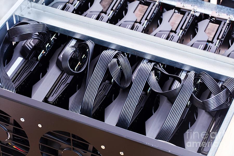 Bitcoin and cryptocurrency miner - a mining computer. Photograph by ...