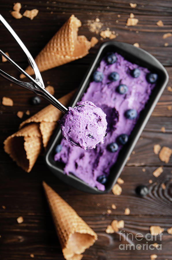 Flat lay view at blackberry icecream in tray with wafer cones as ...