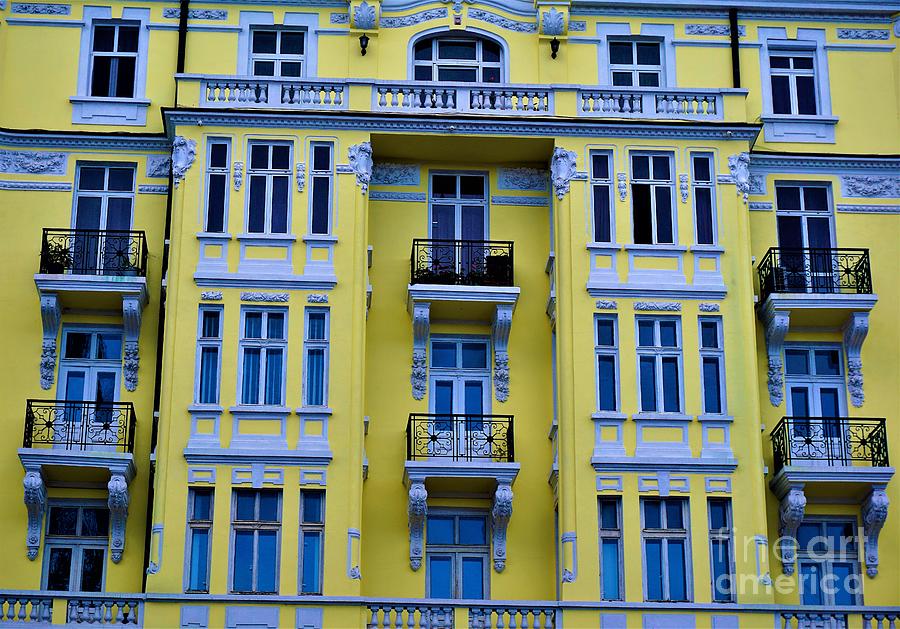 Beautiful yellow building with windows, balconies and stucco in Sofia ...
