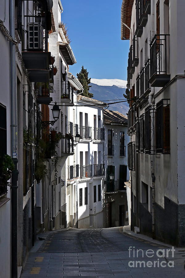 Granada street with mountain view Photograph by Paul Boizot - Fine Art America