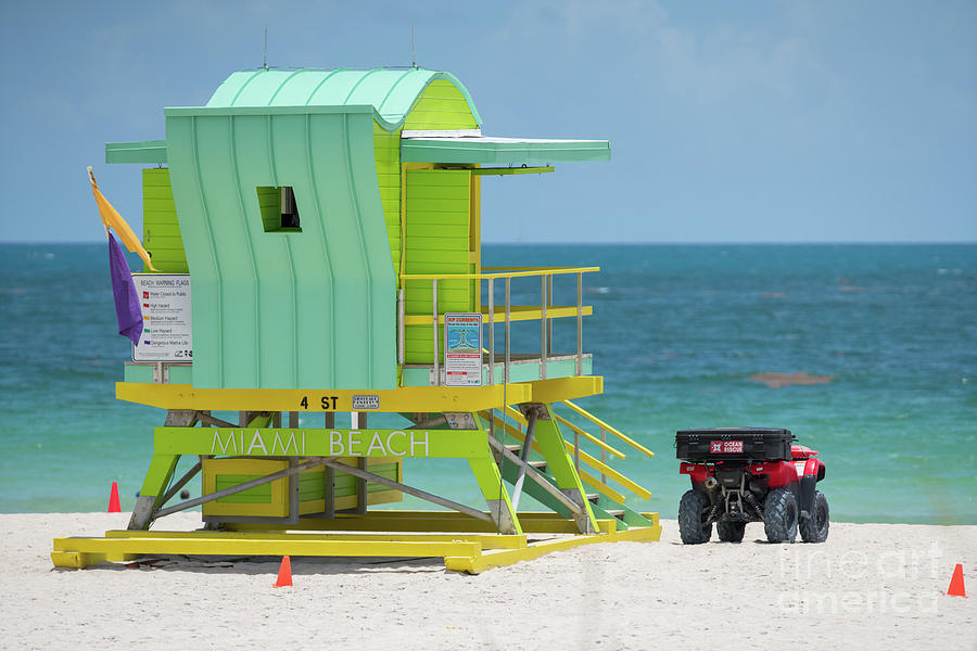 Green Miami Beach lifeguard tower with ocean view in background ...