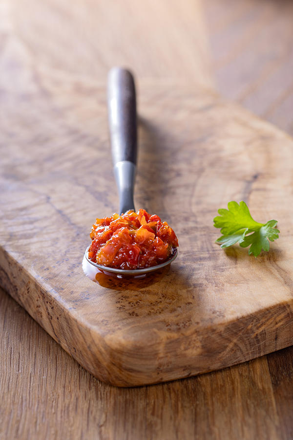 Hot paste made from chilli peppers and bell peppers with oil in ...