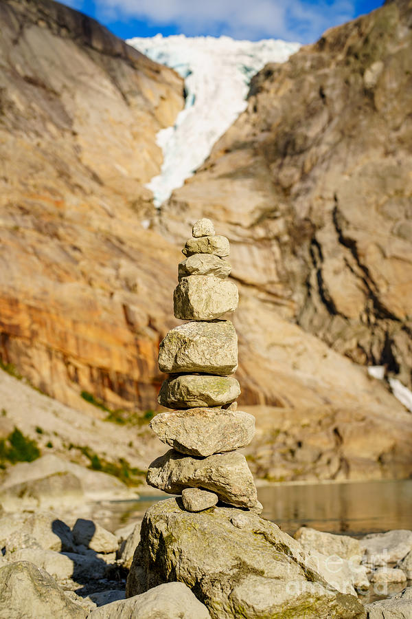 Rock stacking in Norway blurry bokeh background Photograph by Felix ...