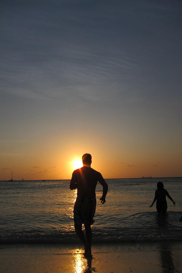 Running into the sun Photograph by Jedd Nero