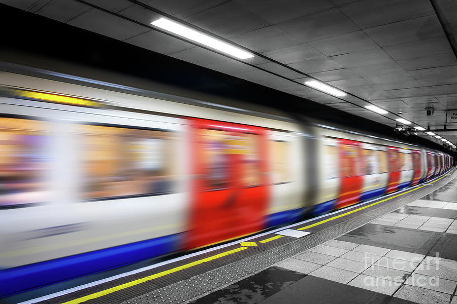 Speed. Tube train in an underground metro station, London Photograph by ...