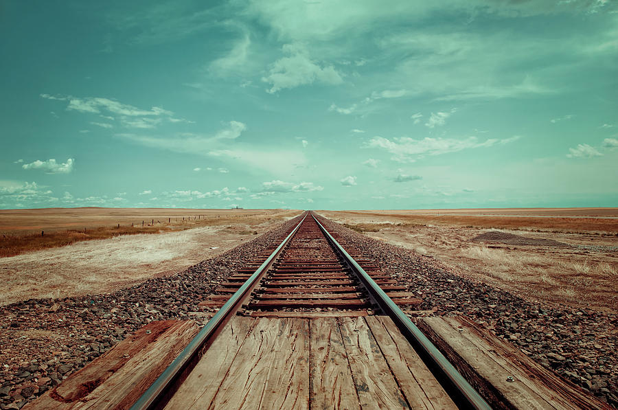 Straight rail track in the wide lands of Montana Photograph by Martina ...