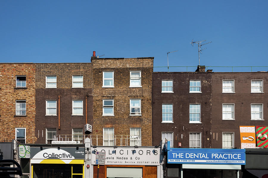 Street frontages and terraced houses building facades in Camden Town ...