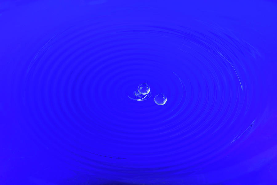 The water drops on ripple water Photograph by Severija Kirilovaite - Pixels